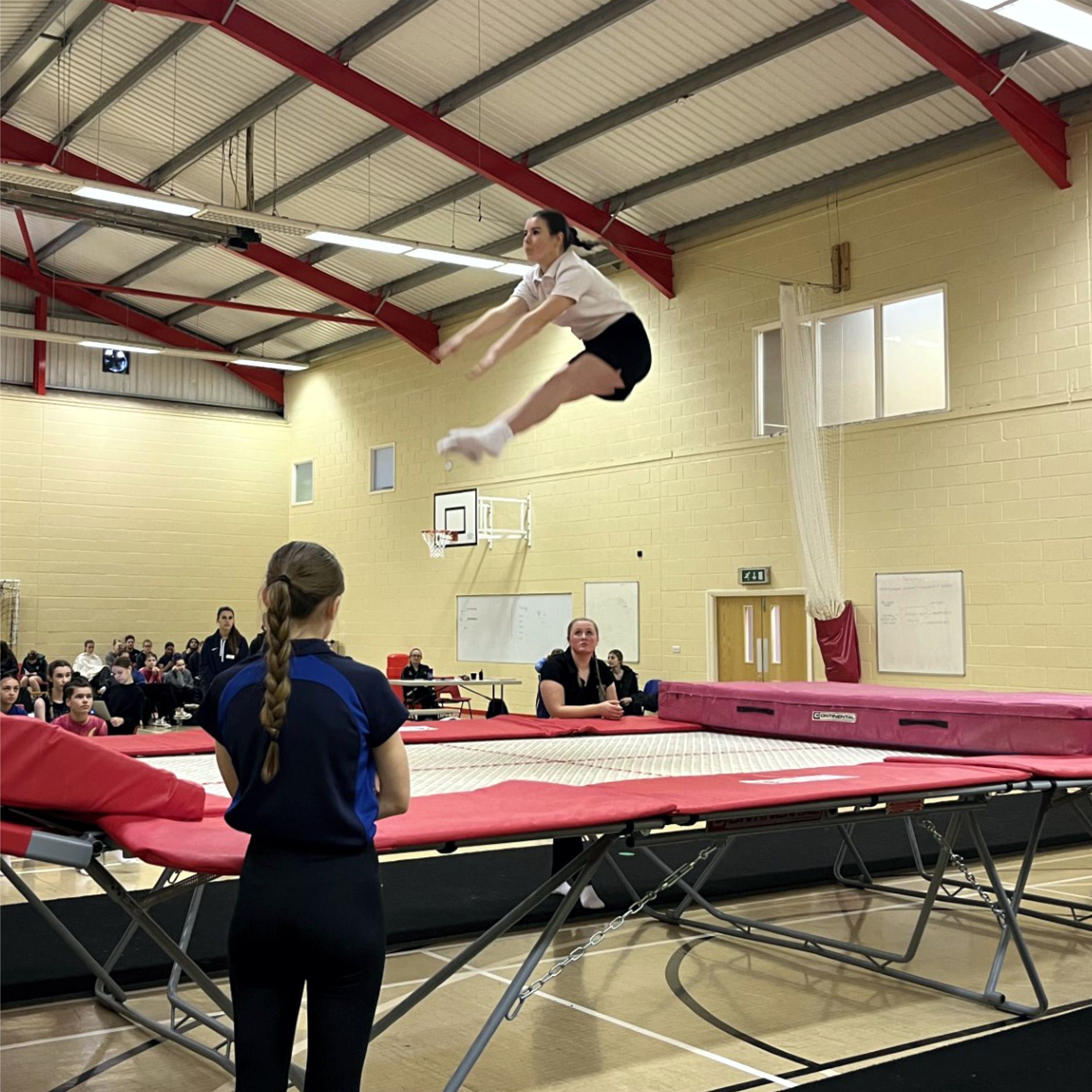 Gymnasts perform jumps, drops and twists at trampoline competition ...